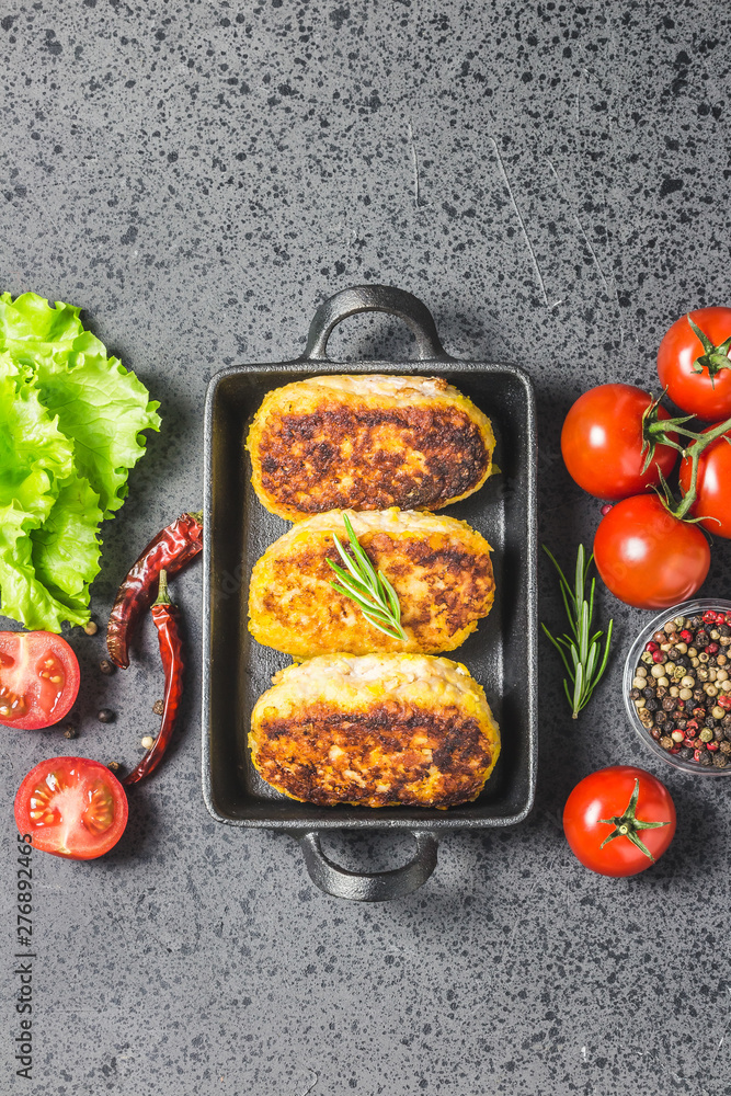 Breaded oven baked rissoles in cast riron pan. Top view, space for text ...