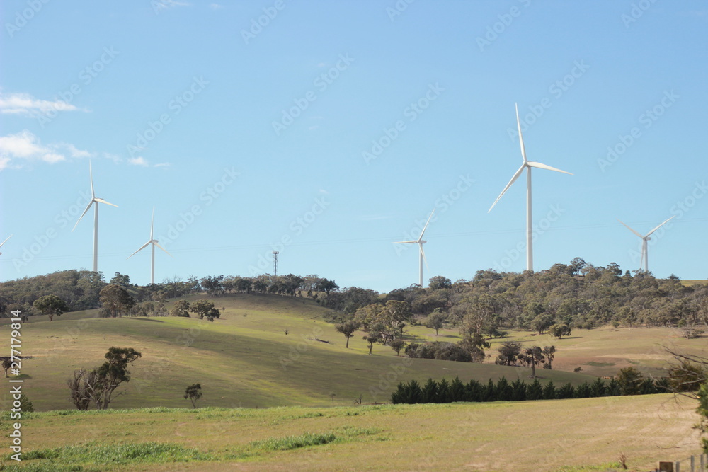 Stock-Foto „panoramic views of multiple windmills at a modern wind farm ...