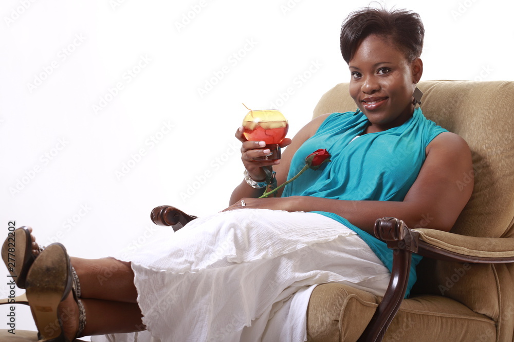 happy black woman relaxing in lounge chair Stock Photo | Adobe Stock