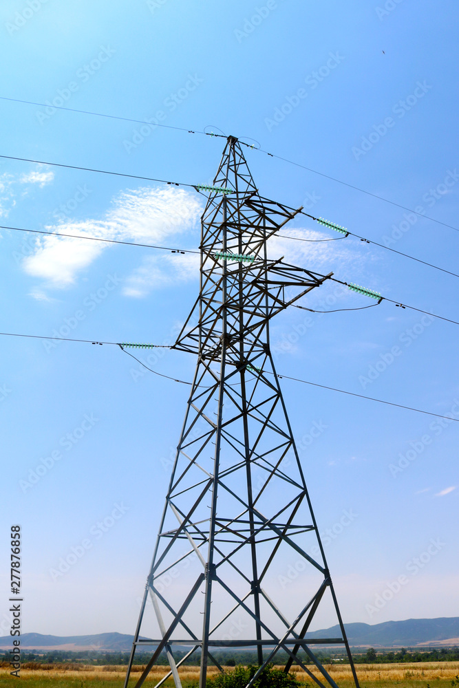 Electricity concept. High voltage electric transmission pylon ...