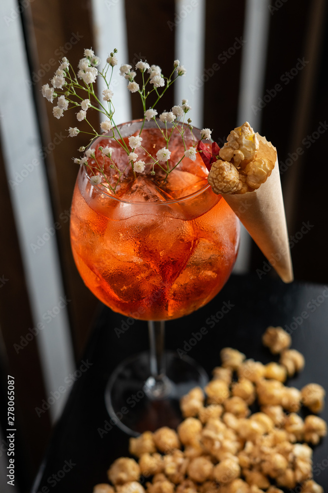Sparkling light alcoholic cocktail with caramel popcorn, based on ...