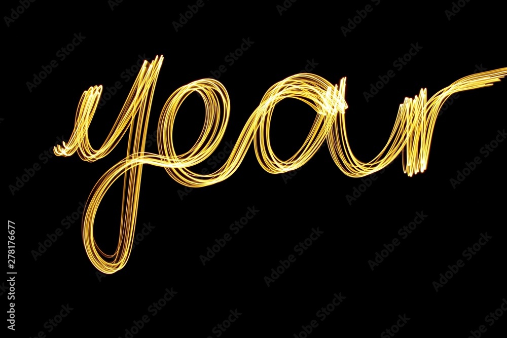 Photo Stock Long exposure photograph of metallic gold colour spelling ...
