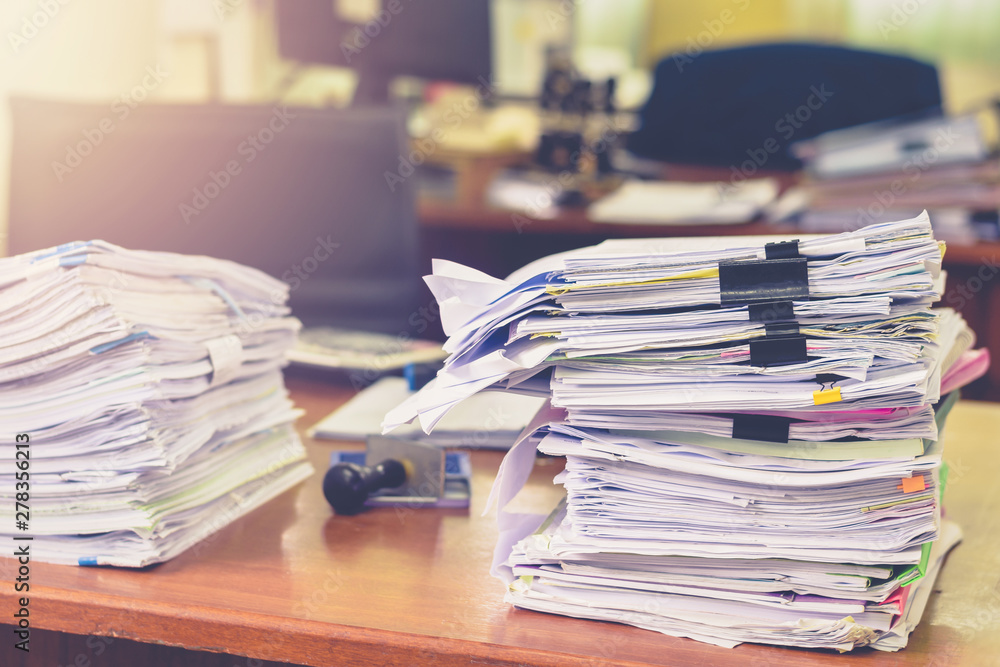 Heap of papers work stack documents on office desk ,business documents ...
