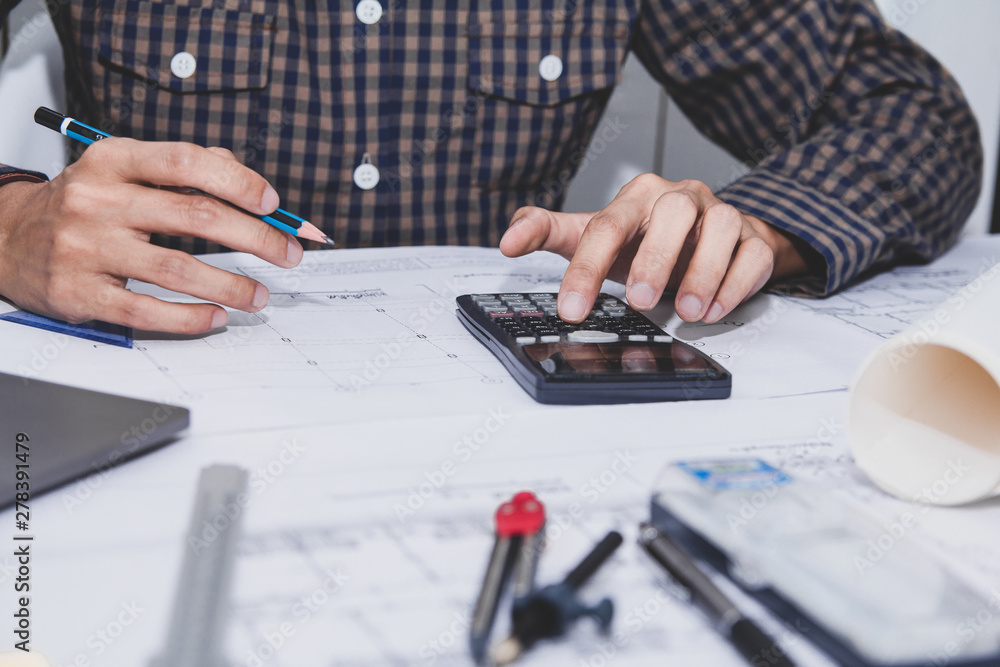 Concept architects, Hand of asian young man engineer using calculator ...