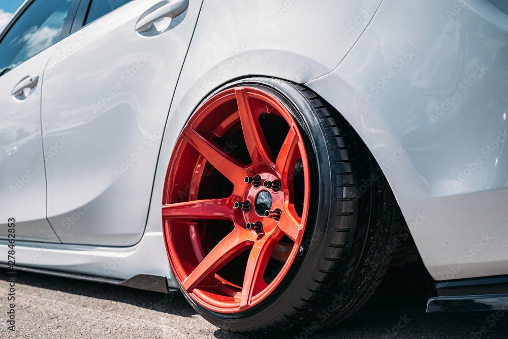 Lowrider custom tuned sport car wheel with small rubber tyre and large ...