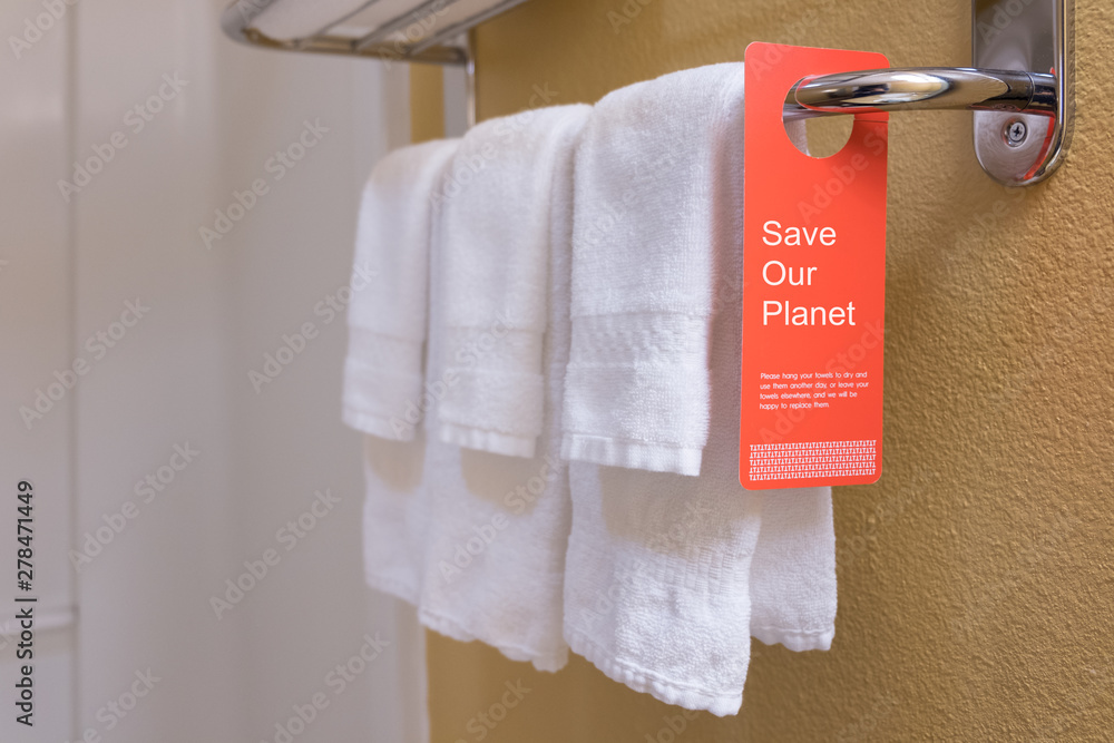 Foto de Stock Save water sign label on hotel encourage guest reuse bath ...