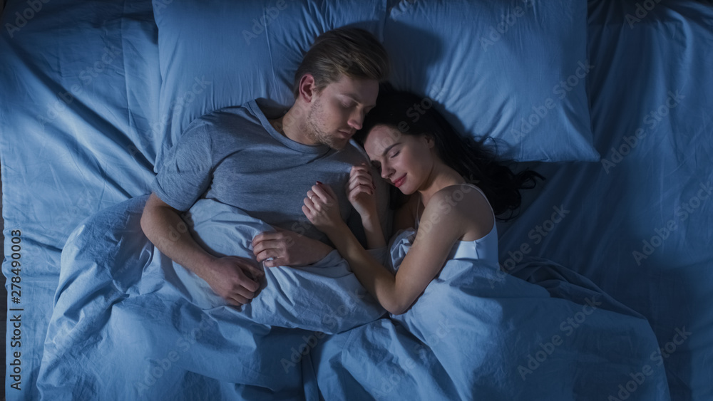 Happy Young Couple Cuddling Together in the Bed Sleeping at Night ...
