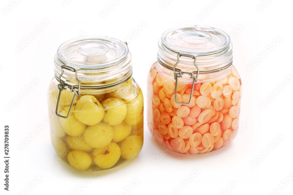Carissa carandas or Carunda and Indian gooseberry preserved in syrup on ...