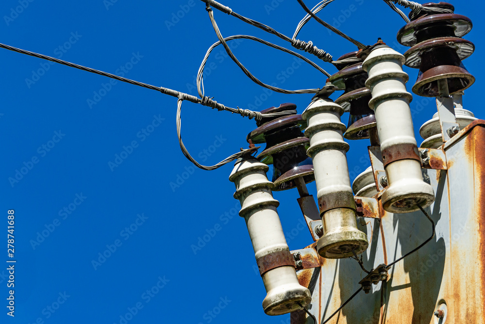 Ceramic insulators mounted on transformer substation close-up. Ceramic ...
