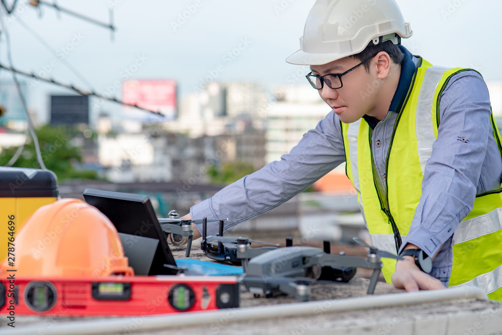 Asian engineer man working with drone, laptop and working tools at ...