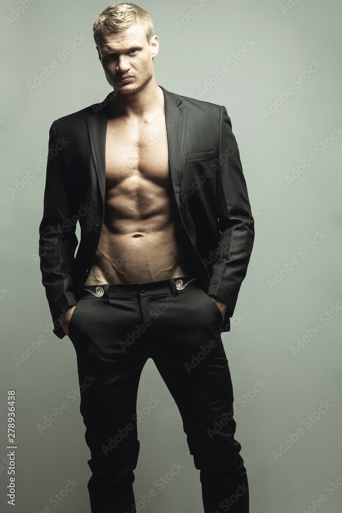 Male fashion concept. Portrait of handsome muscular male model with ...