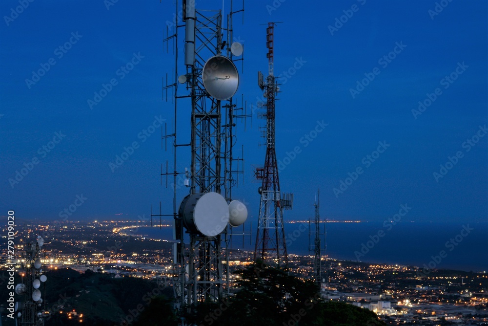 Telecommunications tower, antenna and satellite dish and coastline at ...