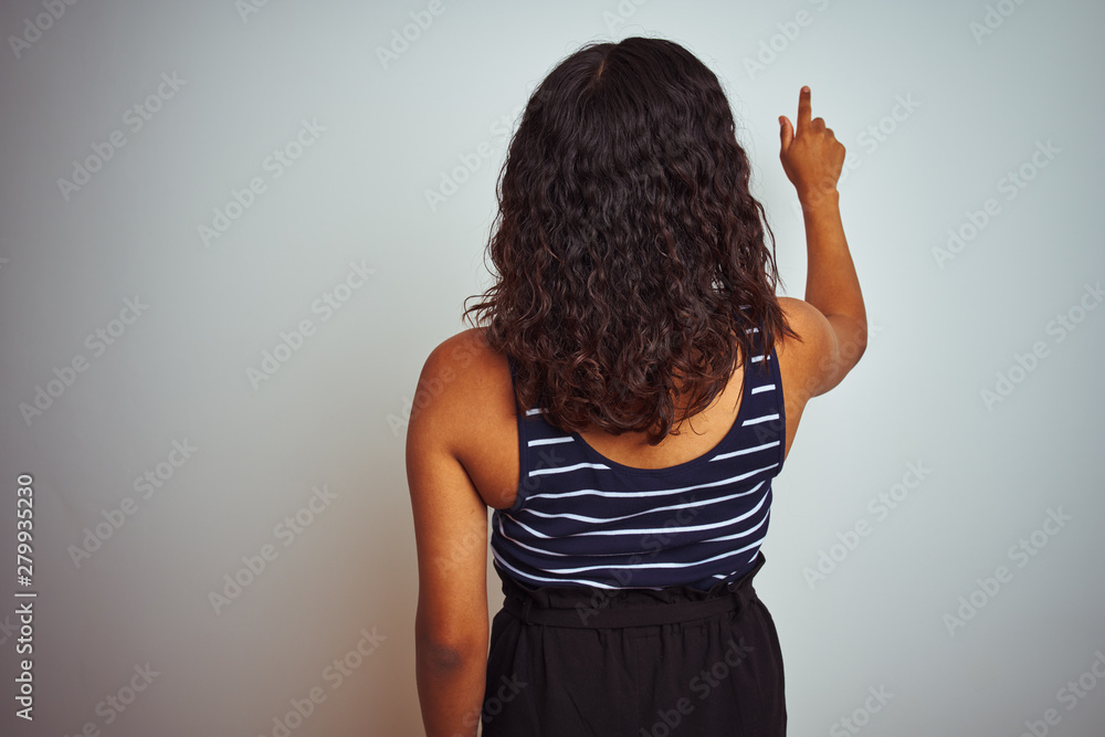 Transsexual transgender woman wearing striped t-shirt over isolated ...