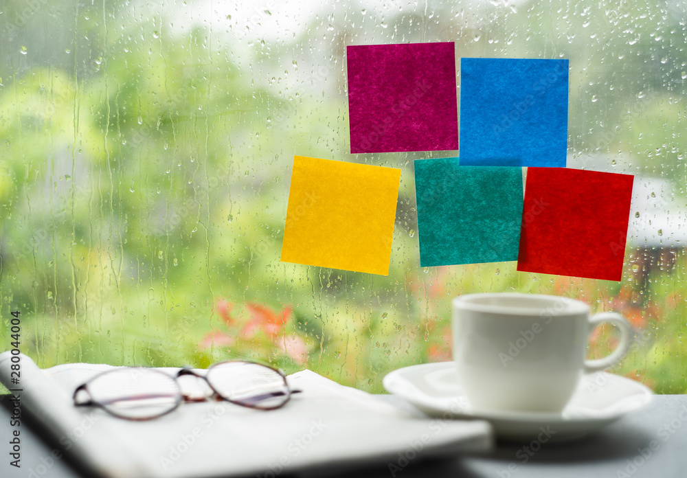Blank colorful post it stick on windows with raining day and blured ...