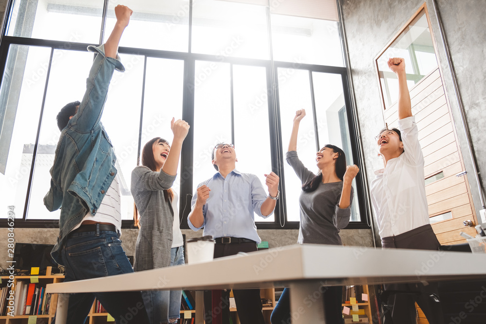 Business people smile and raise hands up, feeling happy, complete ...