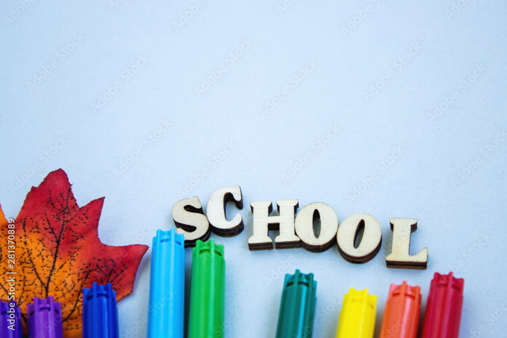 Inscription School, markers and maple leaves. The concept of the ...