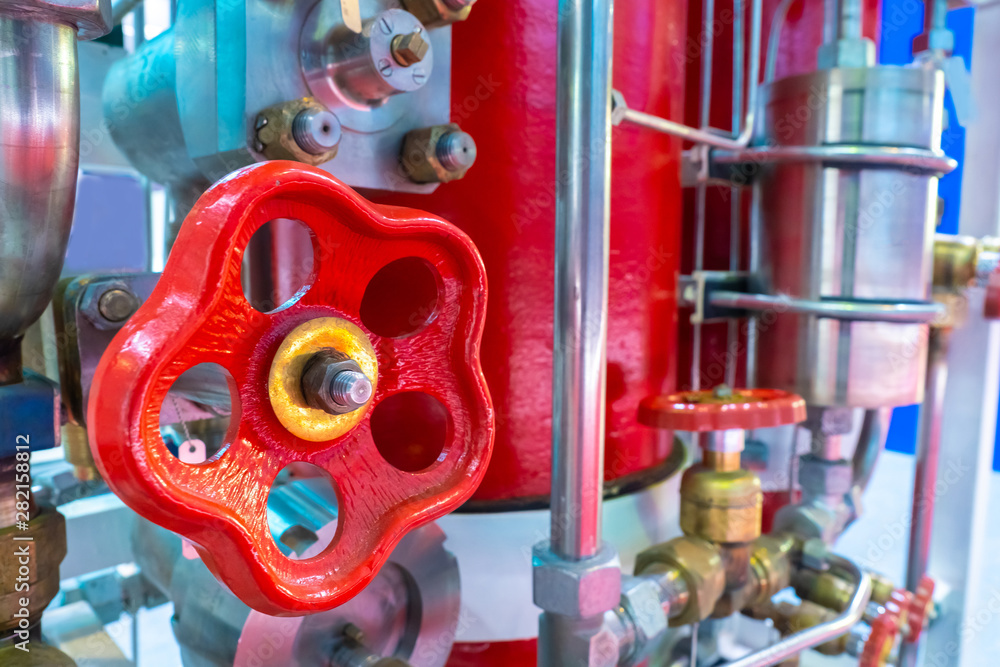 Red valve close-up. Fragment of an automated fire extinguishing system ...