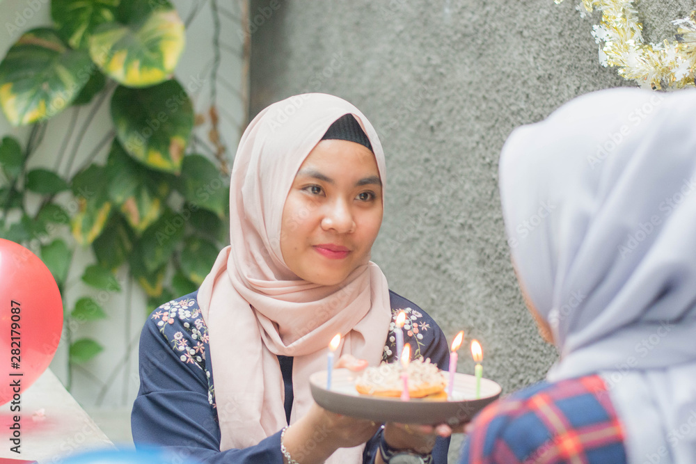 attractive hijab woman giving surprise birthday cake to her bestfriend ...