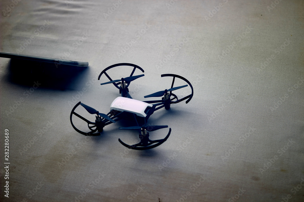 radio controlled drone with smartphone on bed in vacation air ...