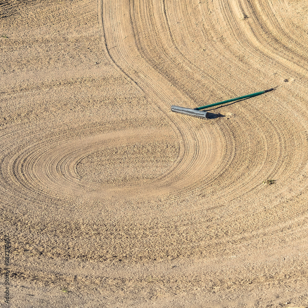 Square Close up of golf course sand bunker with a circular pattern ...