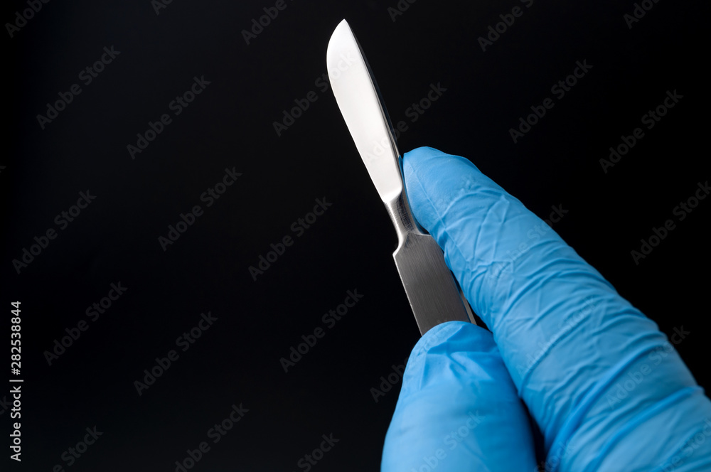 Surgical instruments in operating room and doctor performing surgery ...