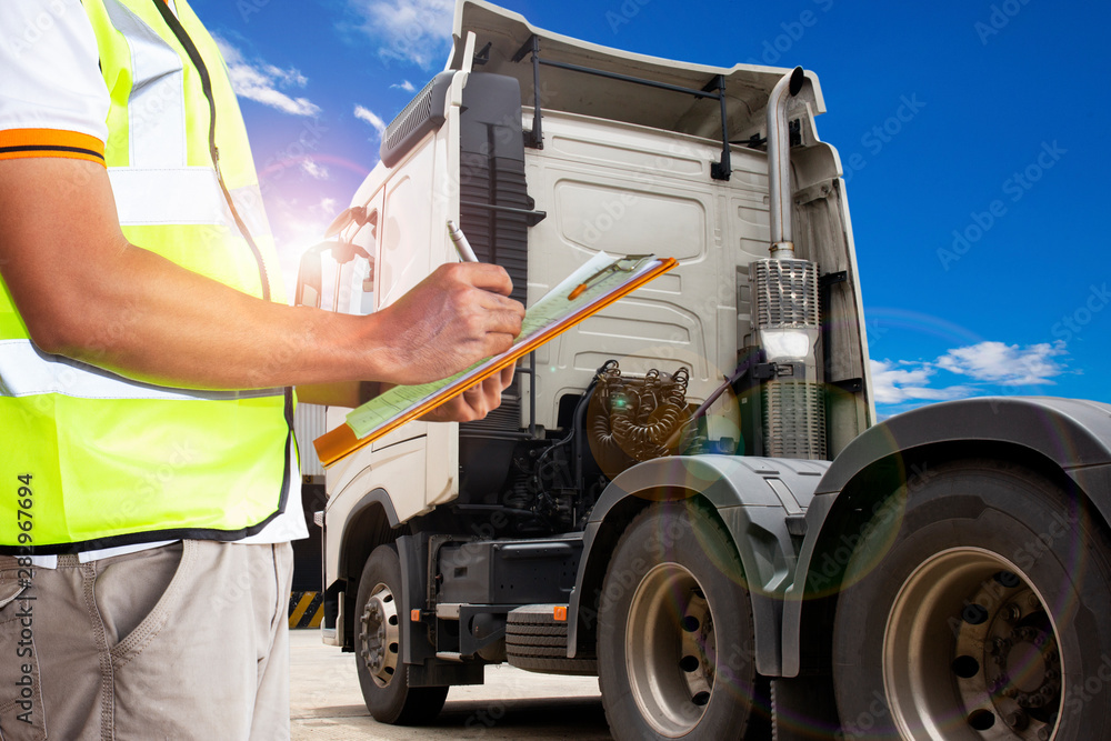 Truck Driver is Checking the Semi Truck's Engine Maintenance Checklist ...