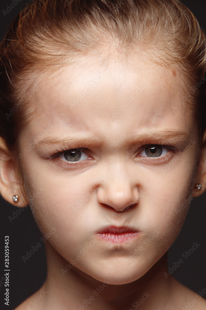 Close up portrait of little and emotional caucasian girl. Highly detail ...