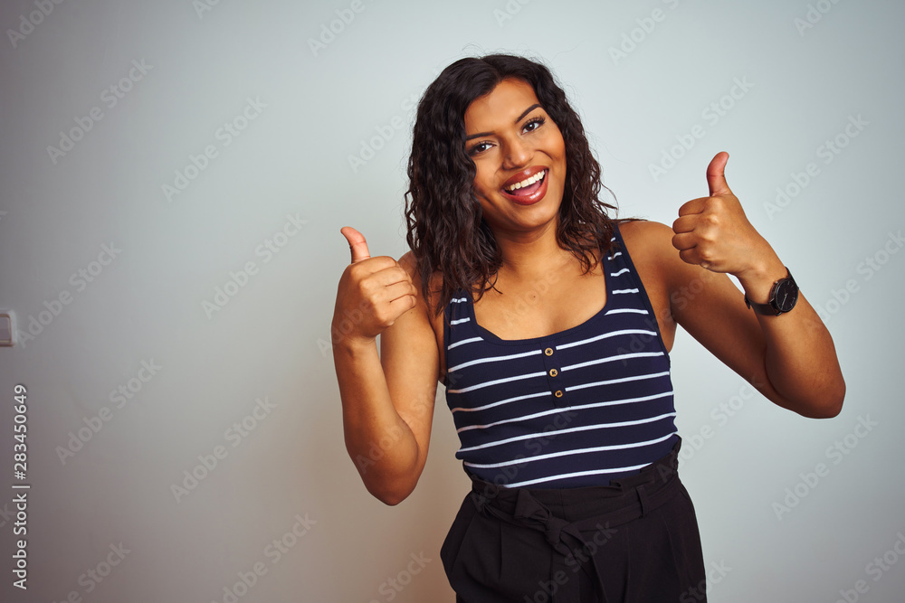 Transsexual transgender woman wearing striped t-shirt over isolated ...