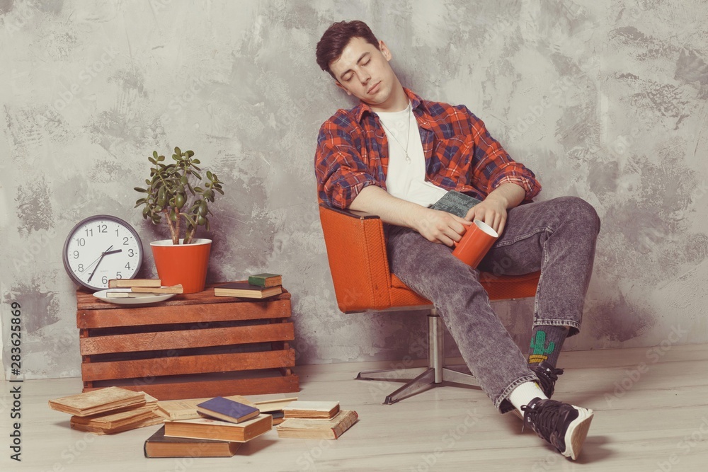 Young boy student sitting in chair with books. Guy want learning, have ...