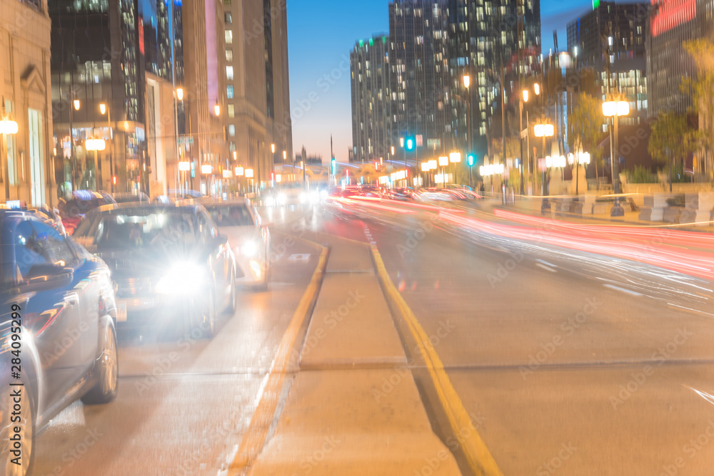 Blurry background Wacker Dr street with tall buildings and street light ...