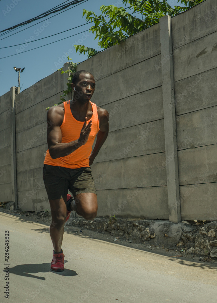 urban runner workout . Young attractive and athletic black African ...