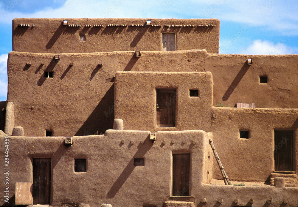 USA, New Mexico, Pueblo de Taos. Adobe multistoried pueblos at Pueblo ...