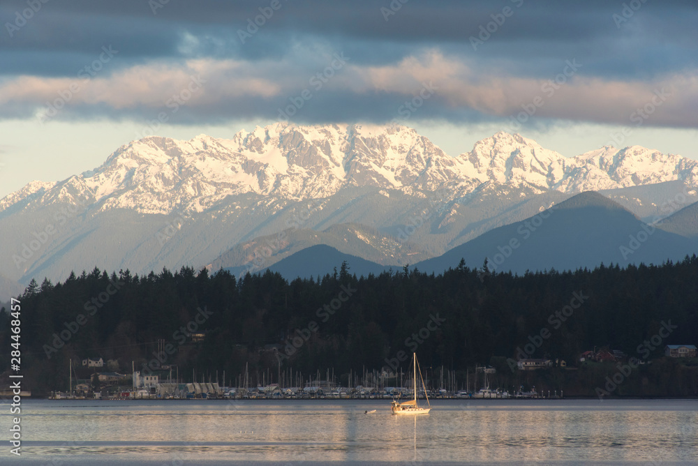 USA, Washington State, Puget Sound. Morning light on sailboat in Port ...