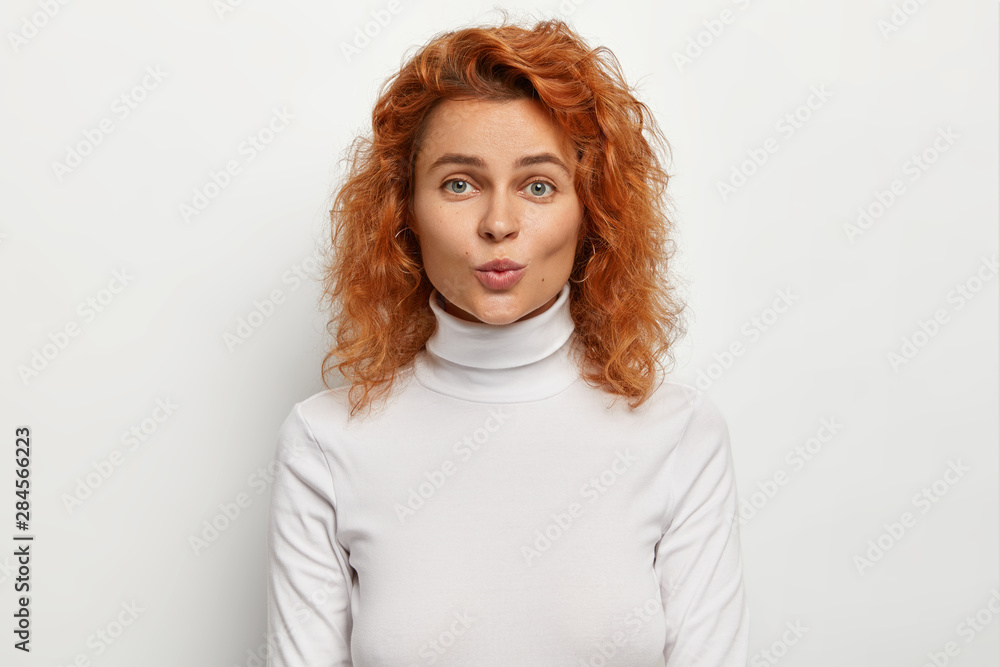 Tender romantic woman feels sensual, keeps lips folded, waits kiss ...