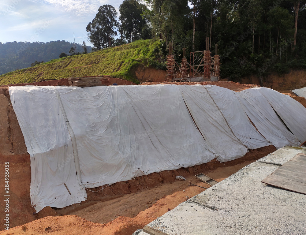 Temporary slope protection during construction using the plastic sheets ...