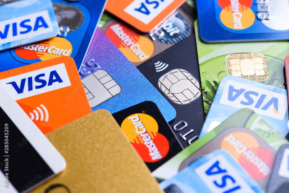 Pile of plastic bank payment cards, Visa and Mastercard, credit and ...