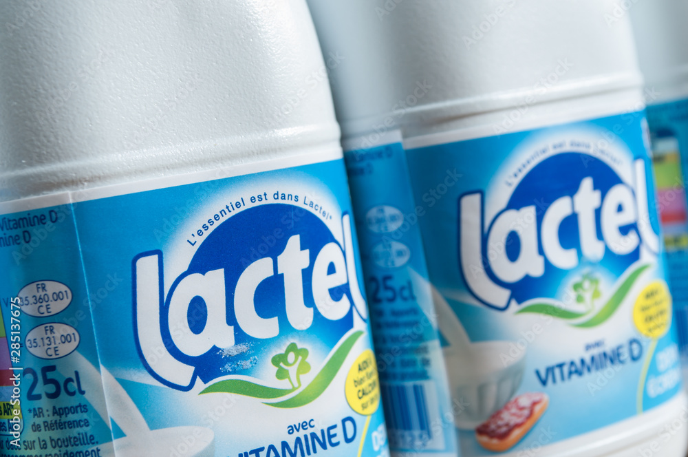 closeup of milk bottles of Lactel brand - Lactel is the french brand ...