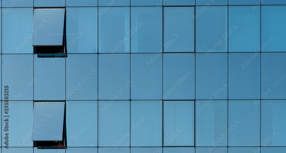 front view of a glass facade with opened windows Stock Photo | Adobe Stock