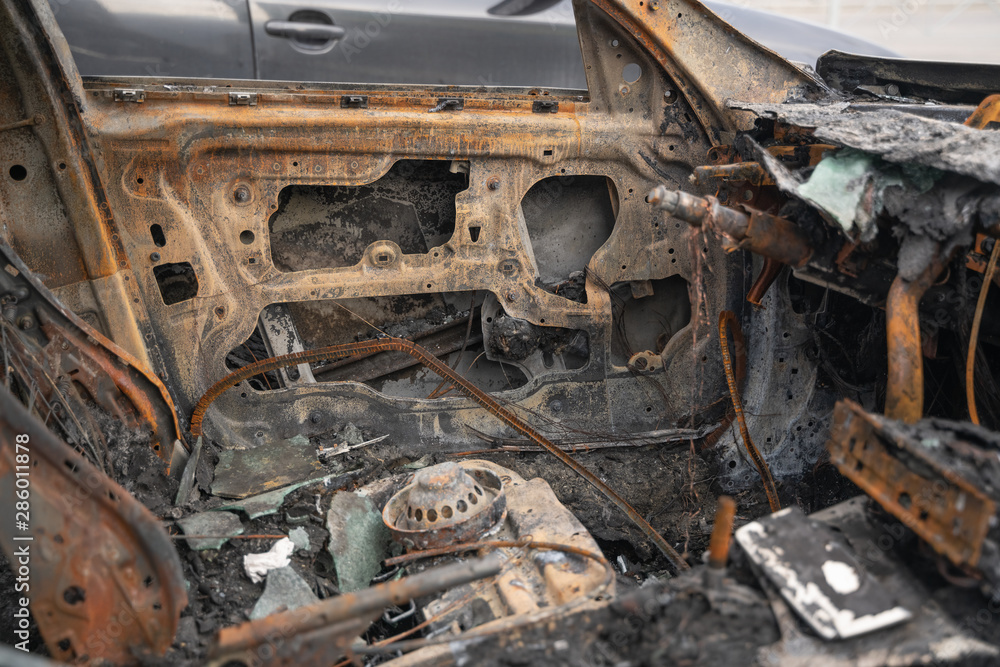 crushed melt car after deliberate arson. destroyed vehicle after a fire ...