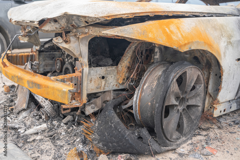 crushed melt car after deliberate arson. destroyed vehicle after a fire ...