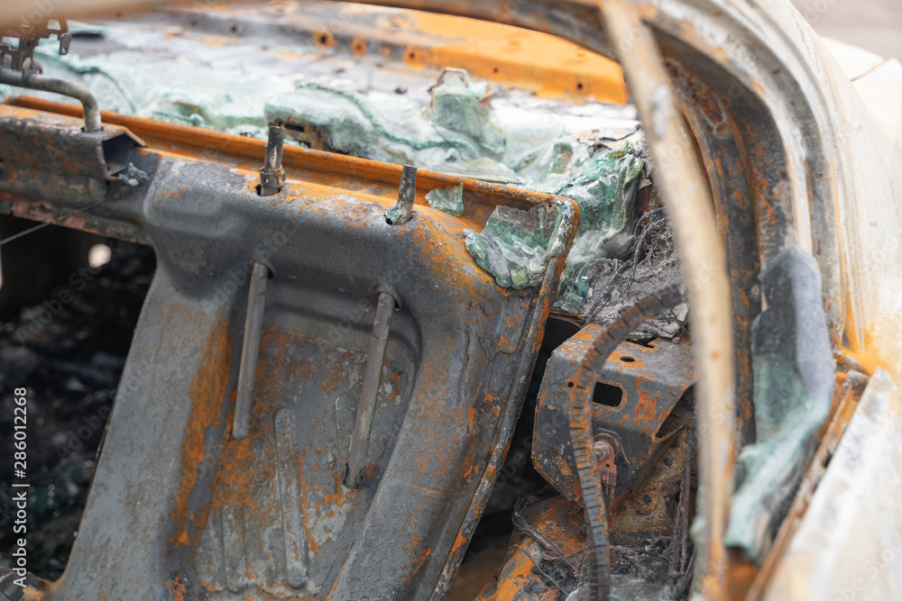 crushed melt car after deliberate arson. destroyed vehicle after a fire ...