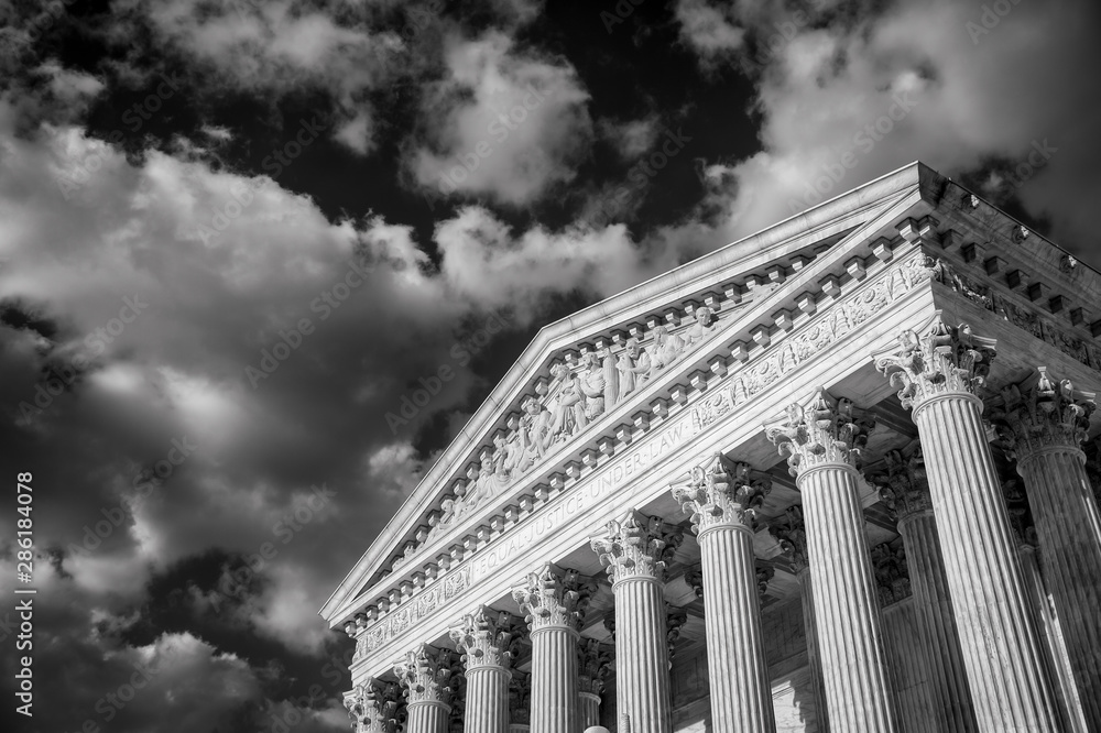 Dramatic black and white view of the neoclassical facade of the Supreme ...