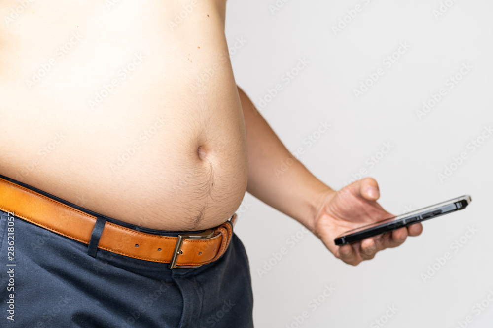 belly of a Japanese fat man holding a mobile phone Stock Photo | Adobe ...