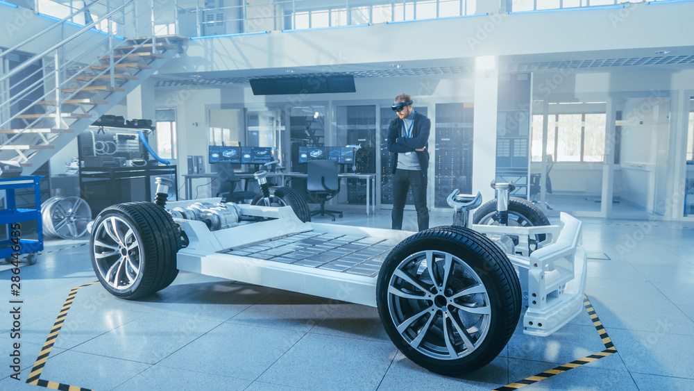 Automotive Engineer Working on Electric Car Chassis Platform, Using ...