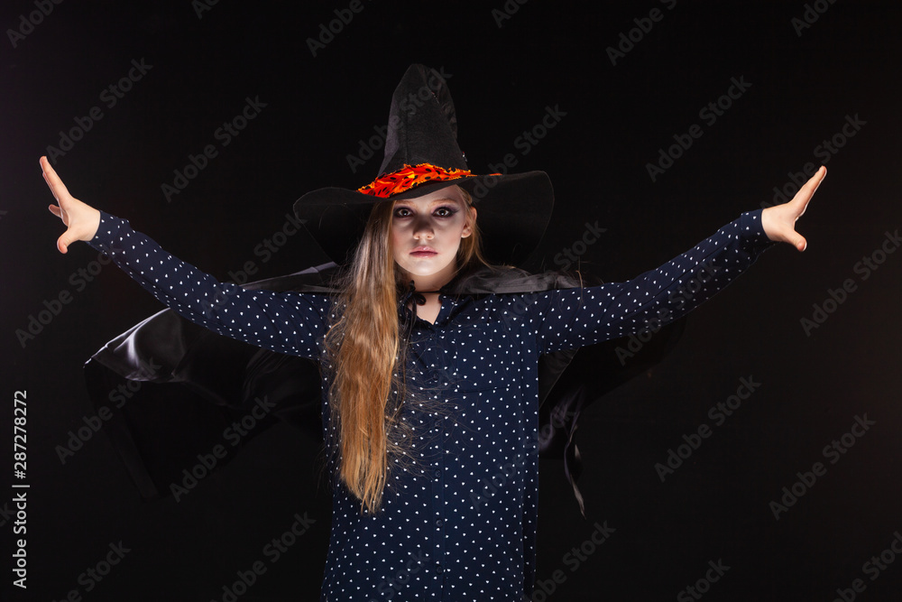 Halloween. Witch with a spider on his hat on black background ...