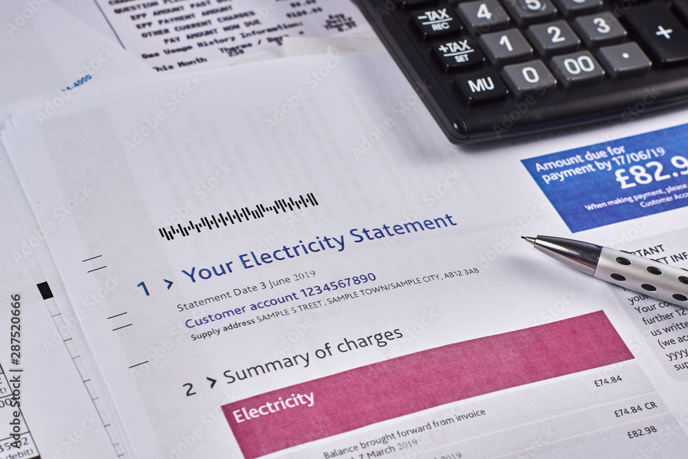 Electricity statement sheet with calculator and pen. Close-up Stock ...