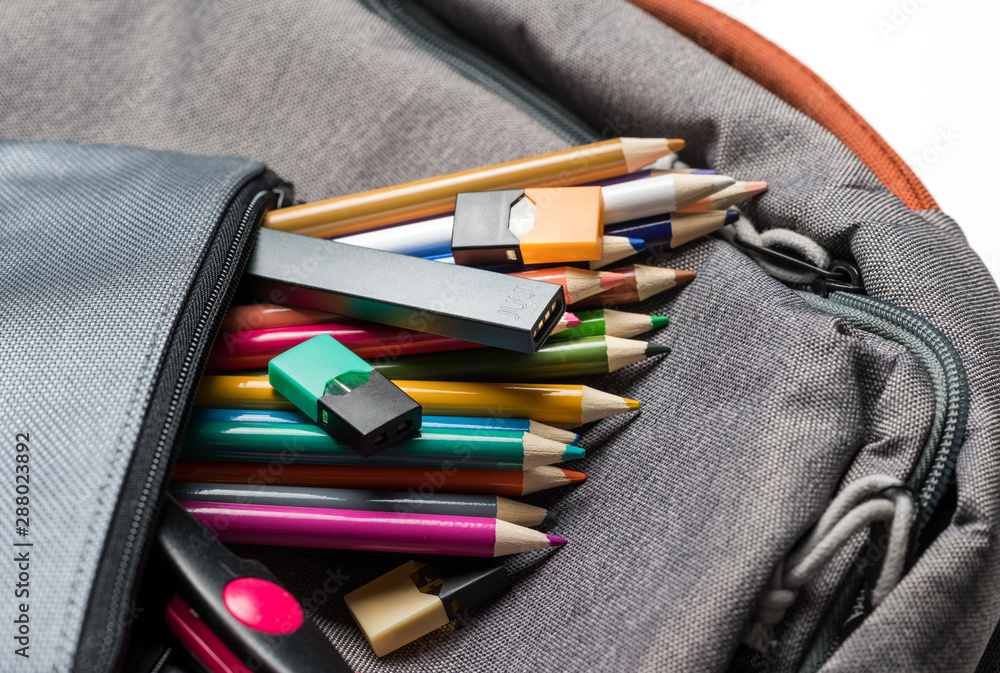 JUULpods and dispenser hidden inside pencil case Stock Photo | Adobe Stock