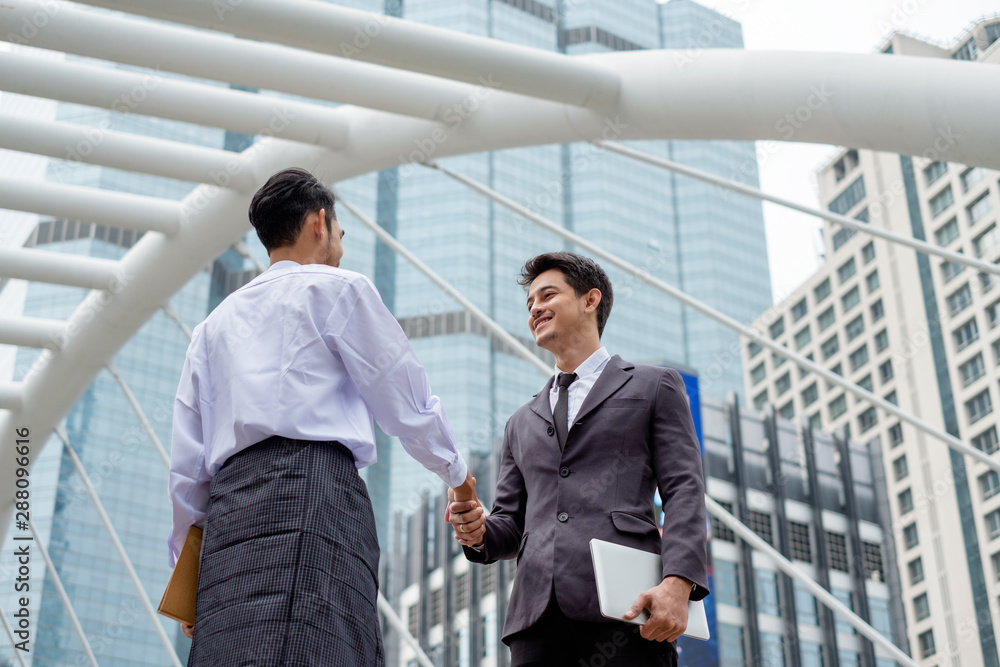 Handsome businessman partnership with handshake agreement of asean ...