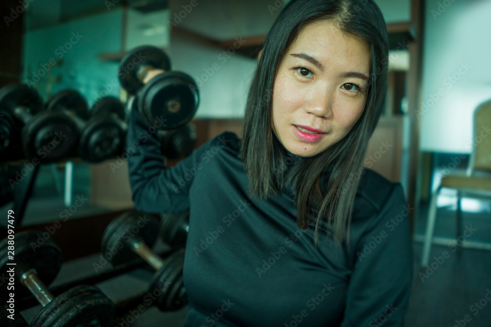 young beautiful and happy Asian Chinese woman in sport hoodie posing ...