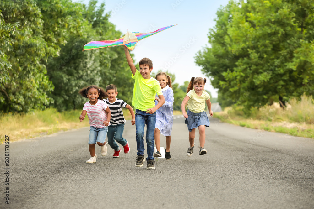 Little children flying kite outdoors Stock Photo | Adobe Stock